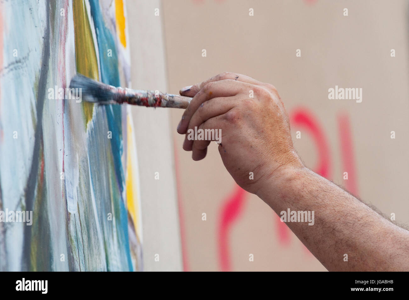 Male artist holding painting hi-res stock photography and images - Alamy