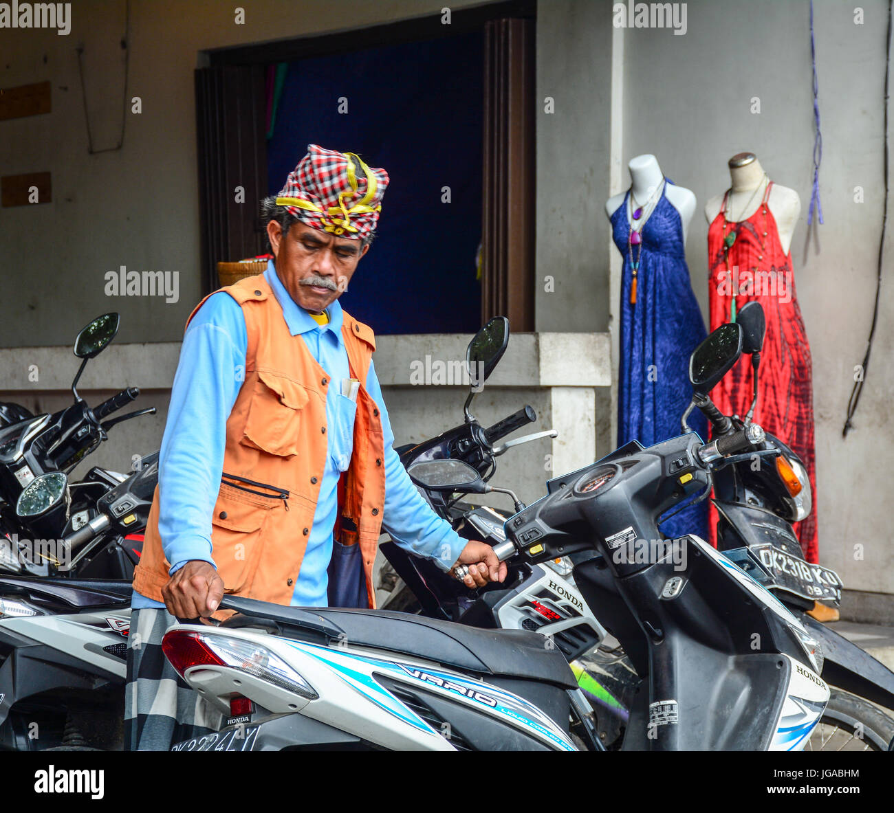 Bali, Indonesia - Apr 21, 2016. A Burmese man working at market in Bali ...