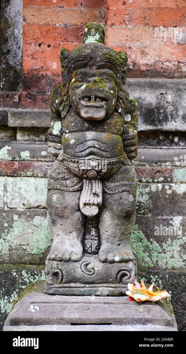 A God Statue at the Elephant temple in Bali, Indonesia. Bali is a ...
