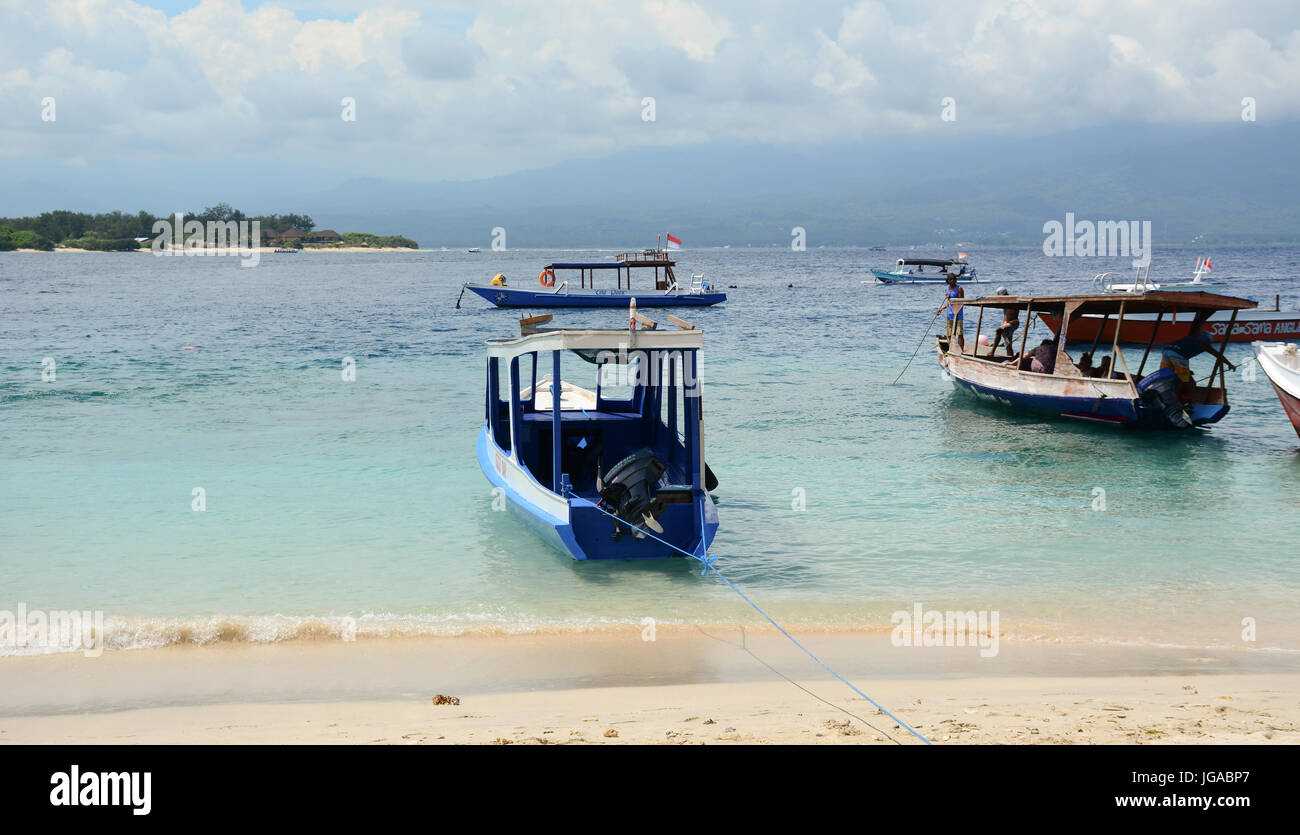 Lombok, Indonesia - Apr 18, 2016. Wooden boats docking at the tourist ...