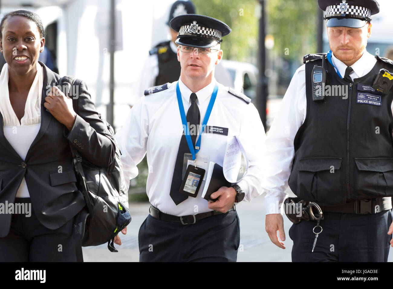Police officers arrive at Kensington Olympia in west London to attend a ...