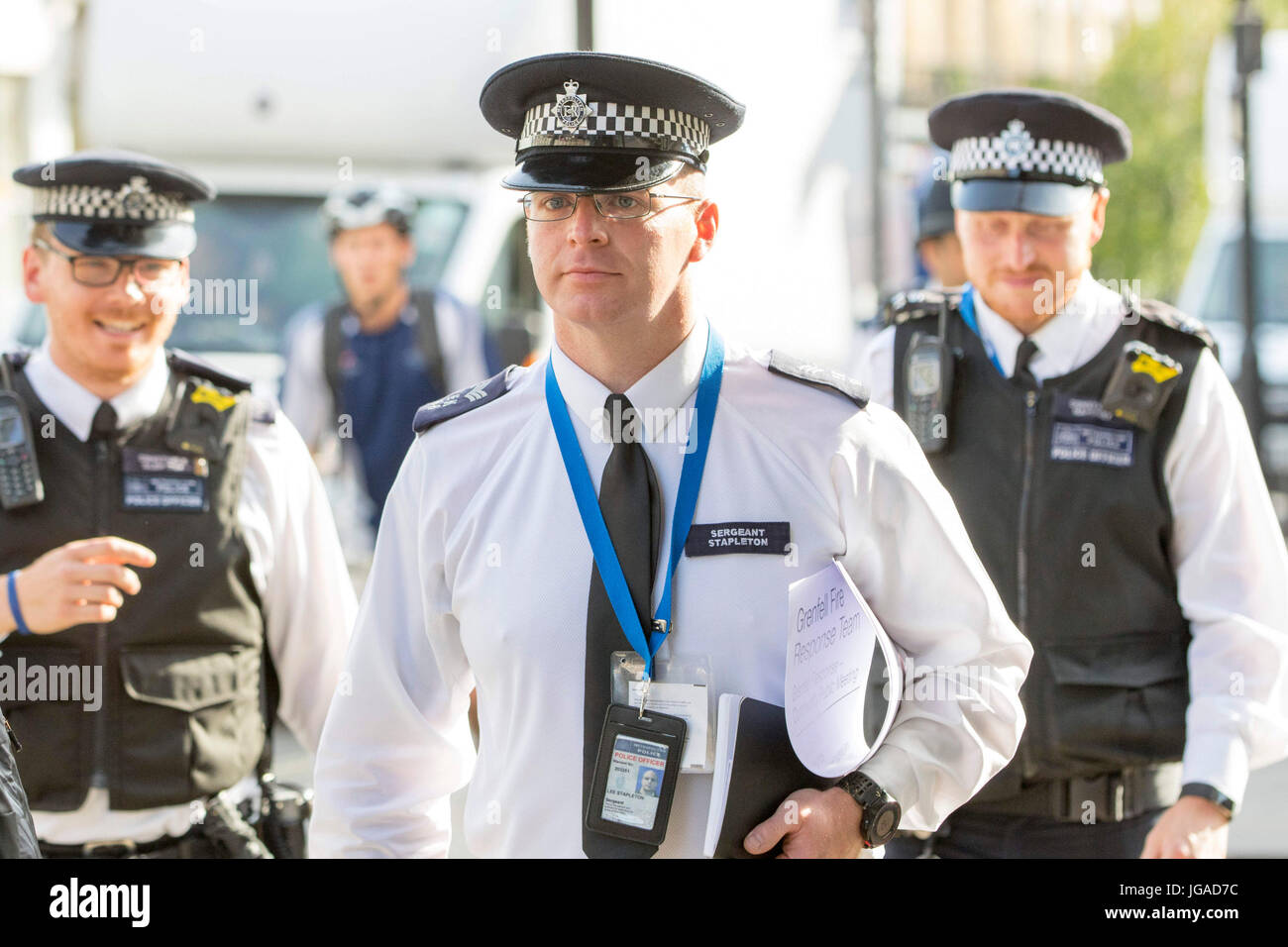 Police officers arrive at Kensington Olympia in west London to attend a ...
