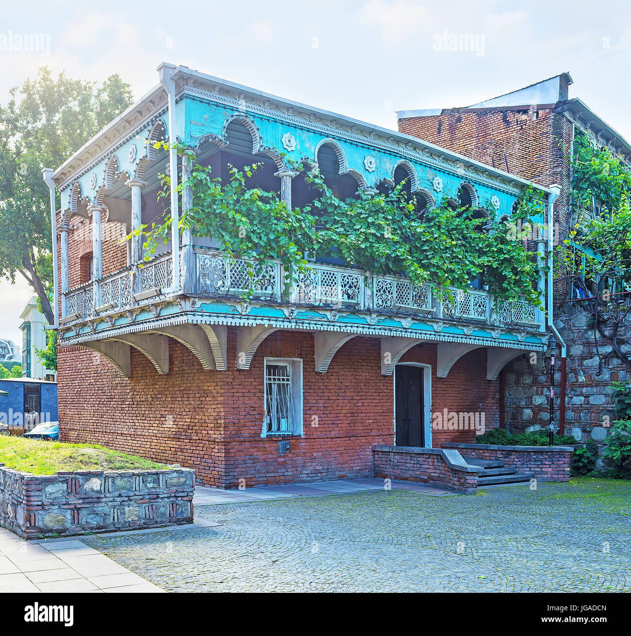 Traditional edifice of old town, decorated with colorful open wooden ...