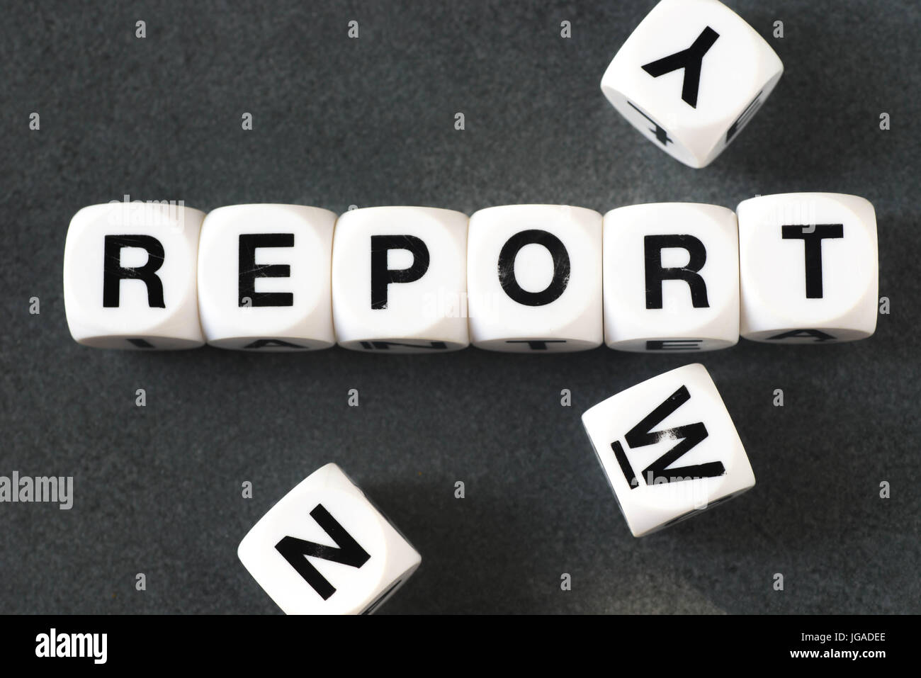 word report on white toy cubes Stock Photo - Alamy