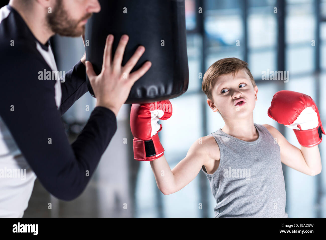 young boy boxer practicing punches with coach Stock Photo - Alamy