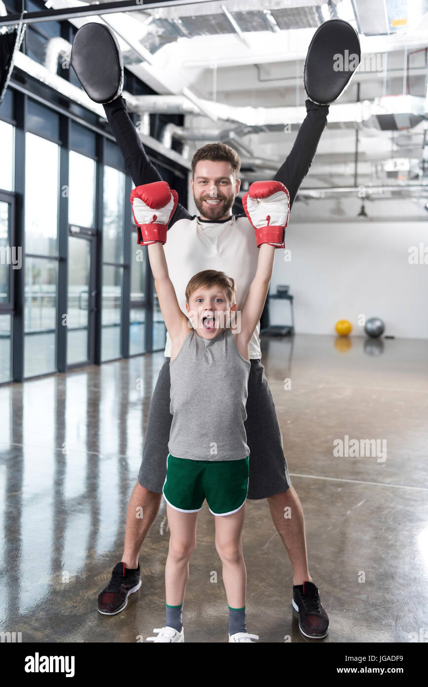 Excited young boy boxer with his coach at training Stock Photo - Alamy