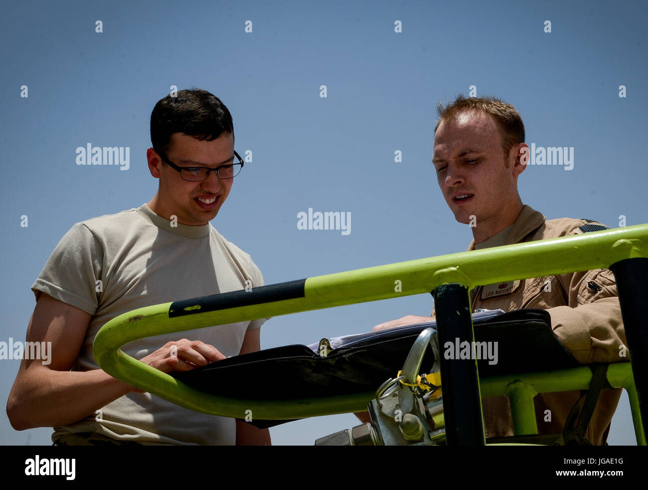 A U.S. Air Force KC-135 Stratotanker pilot, right, and boom operator ...