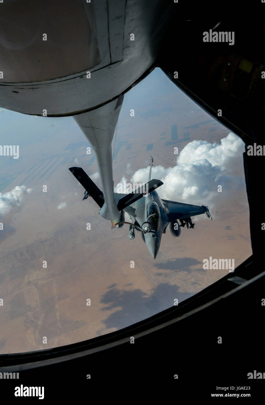 A French air force Rafale receives fuel from a U.S. KC-135 Stratotanker ...