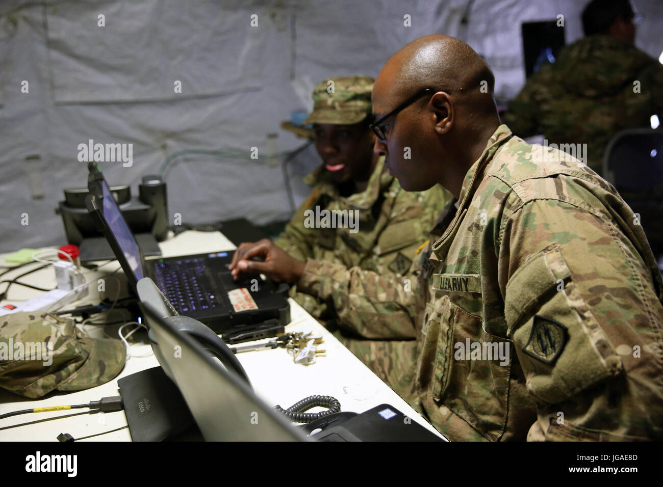 U.S. Army Spc. Justin Pelzer, a Command Post Node operator assigned to ...