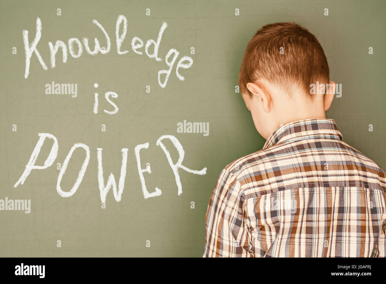 Boy did not learn a lesson and a message on the board "Knowledge is ...