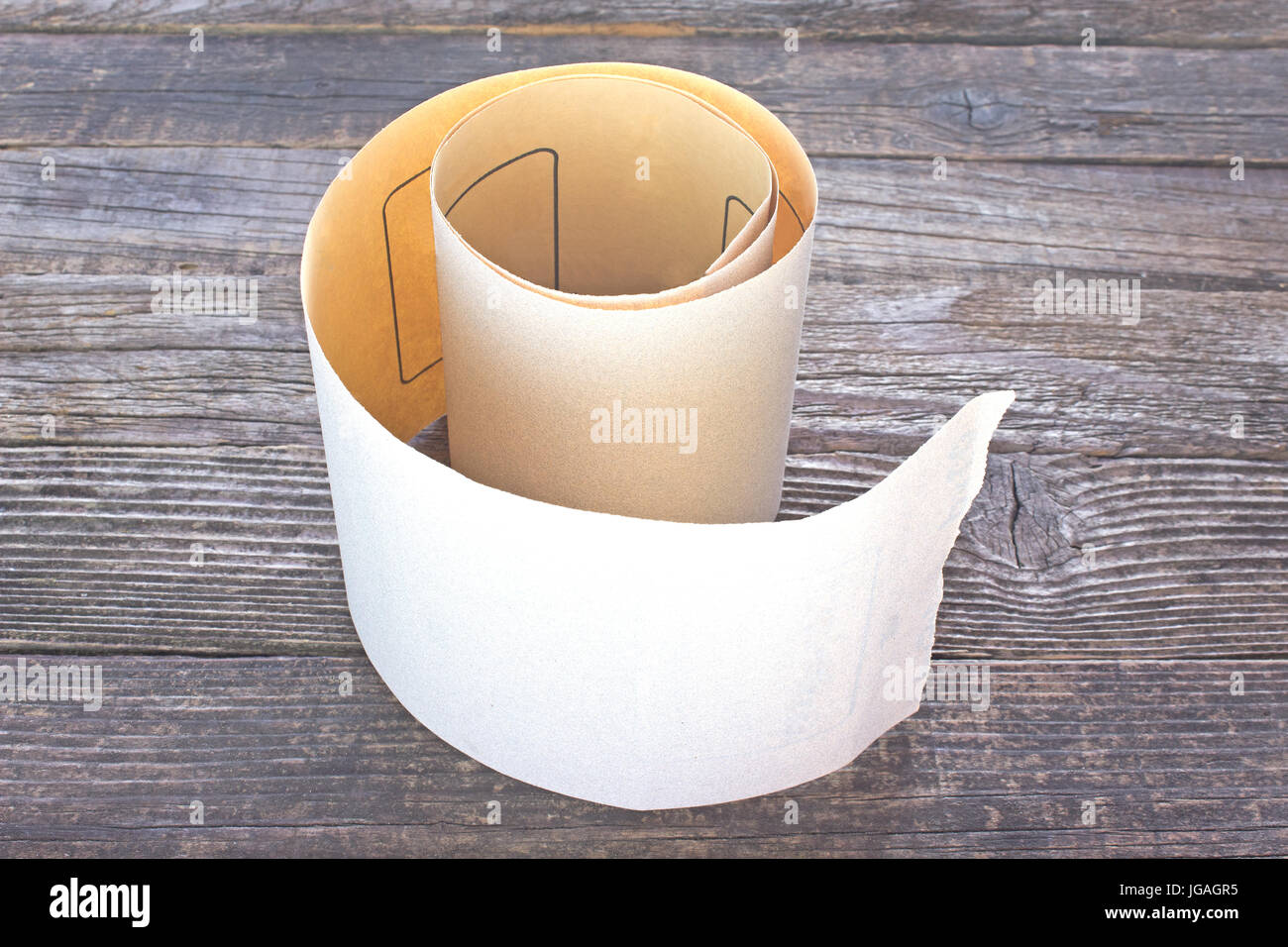 Sandpaper on old wooden background Stock Photo - Alamy