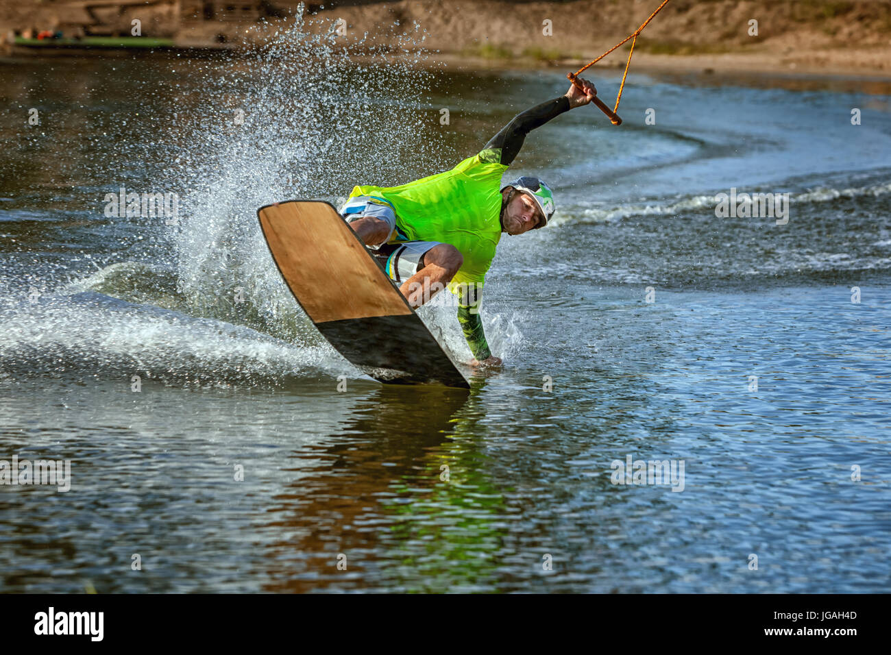 Skating on the surface of the water on the board is a summer sport for ...