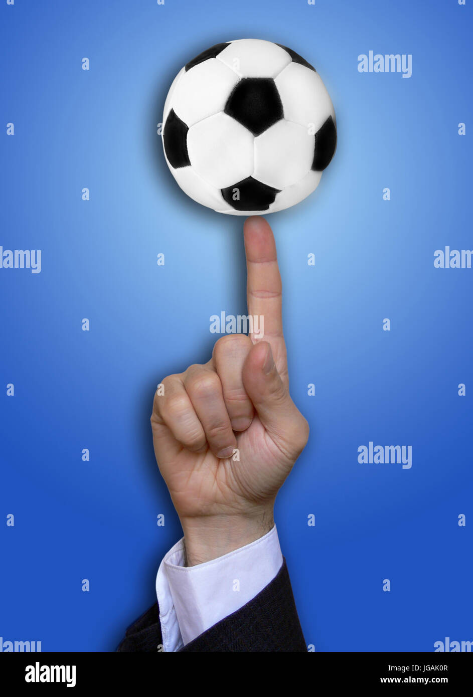 man hand with the finger holding a small ball, soccer business concept ...