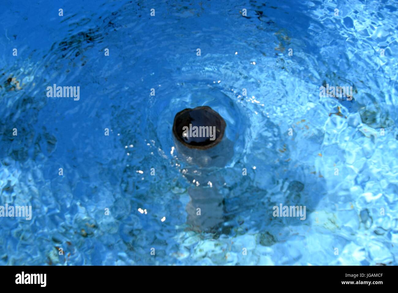 filtered water flows into a swimming pool, water inflow Stock Photo - Alamy