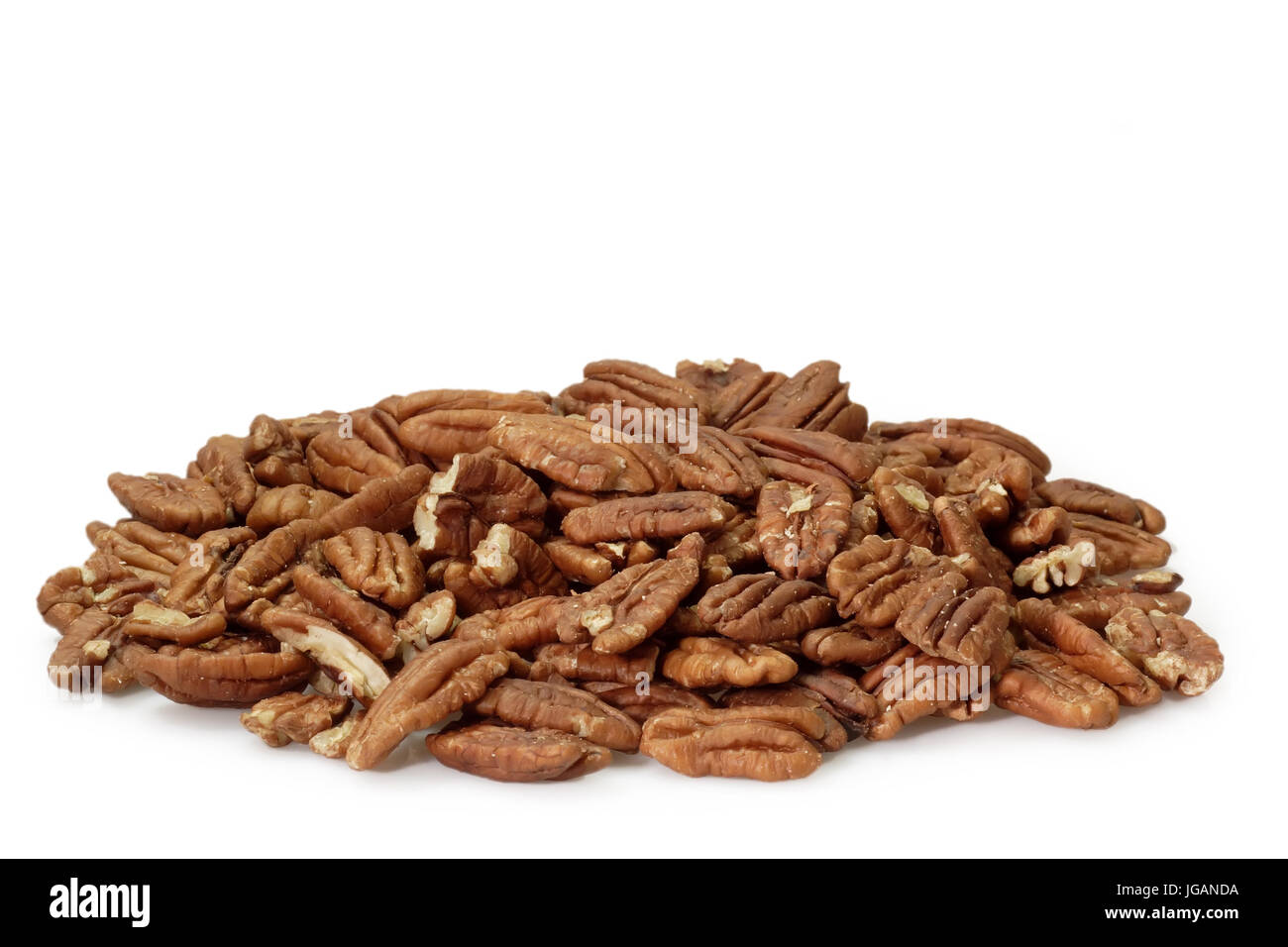Pecan nuts on bright background Stock Photo - Alamy
