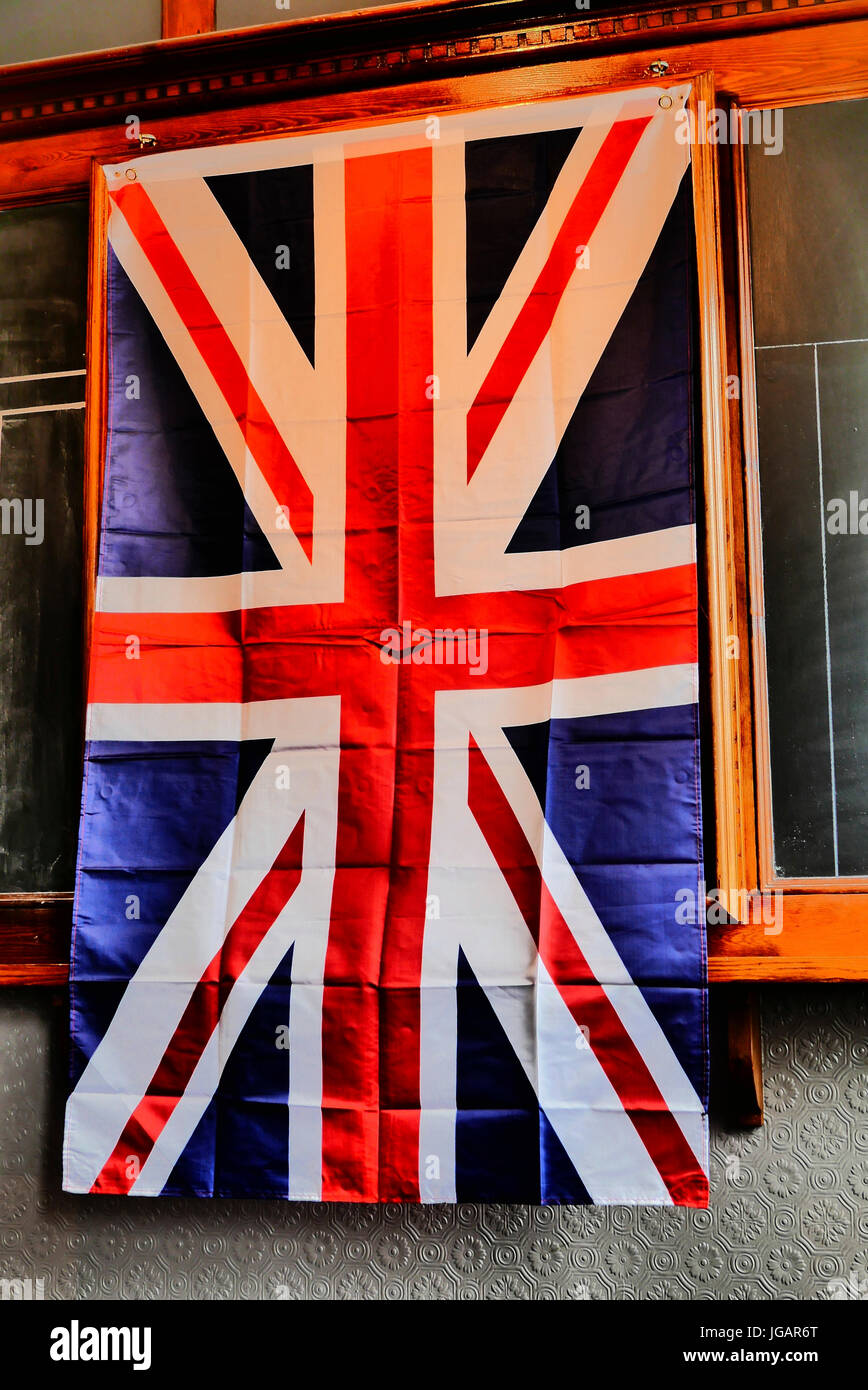 Union Jack flag hanging from interior wall of pub Stock Photo - Alamy