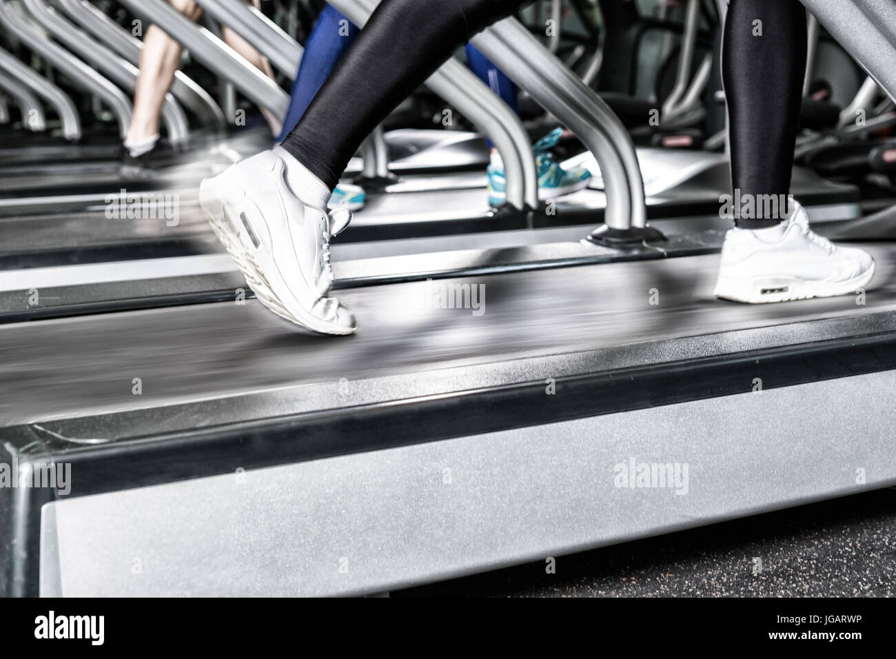 Female legs on a treadmill in fitness sport club Stock Photo - Alamy