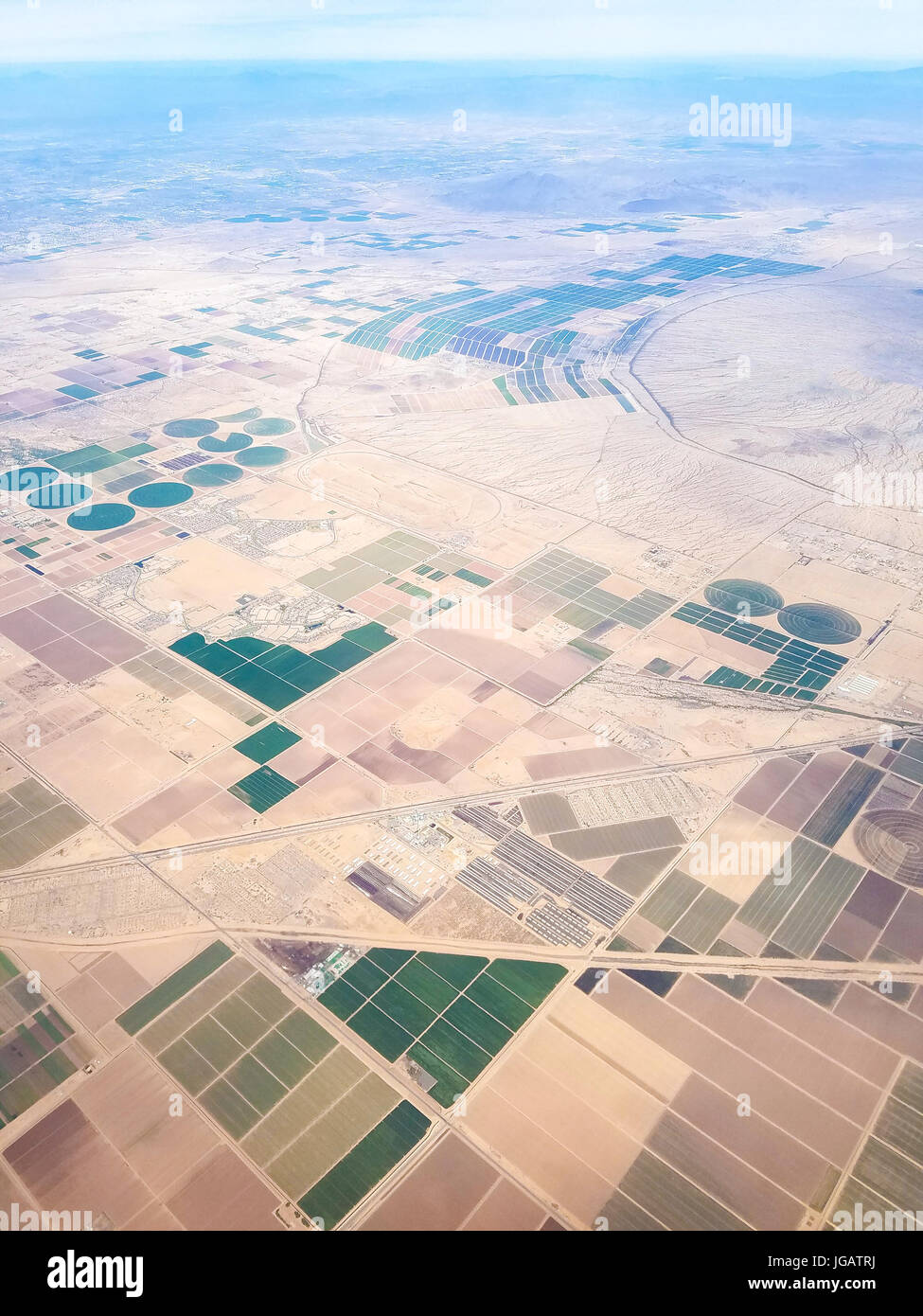 Fields of Arizona, USA, seen from above, with a few neighborhoods in ...
