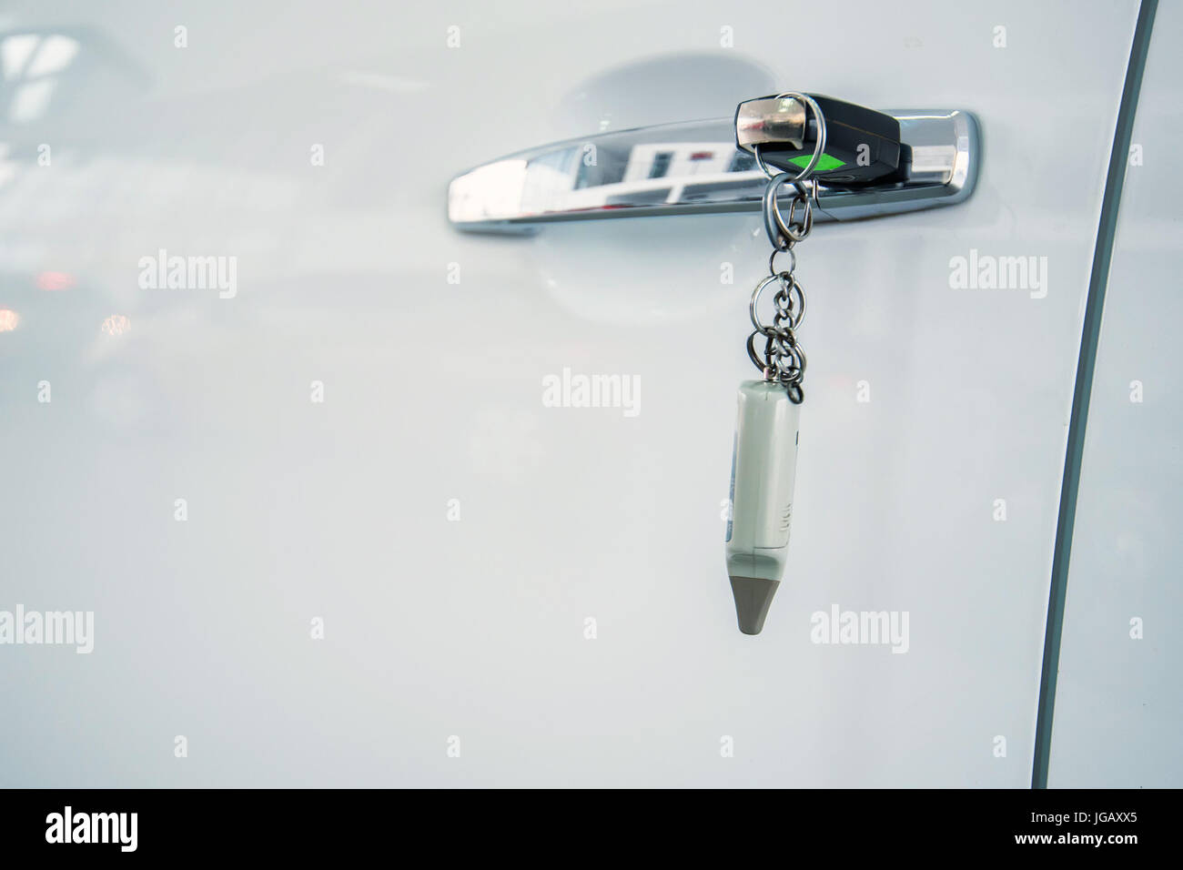 Car key inserted in lock of new modern car Stock Photo - Alamy