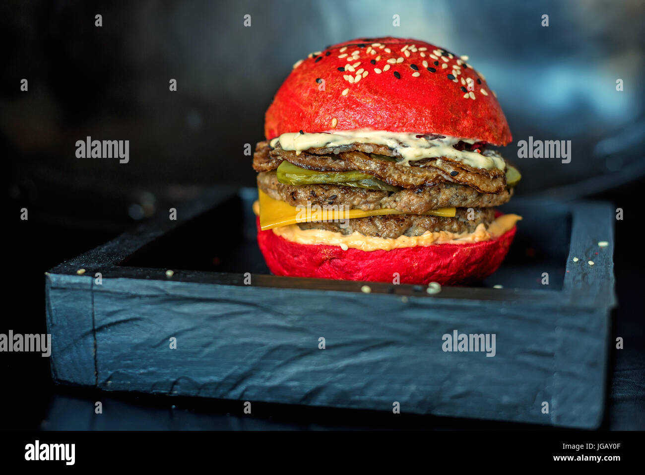 Homemade hamburger with red bun Stock Photo - Alamy