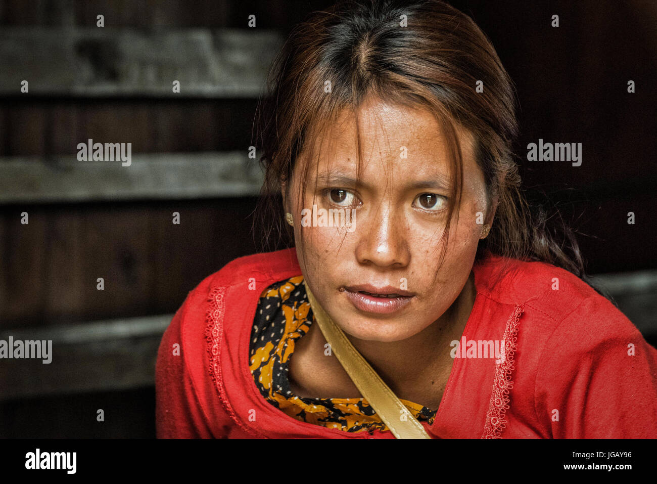 Myanmar, Chin State, portrait of a young mother in a rural village near ...