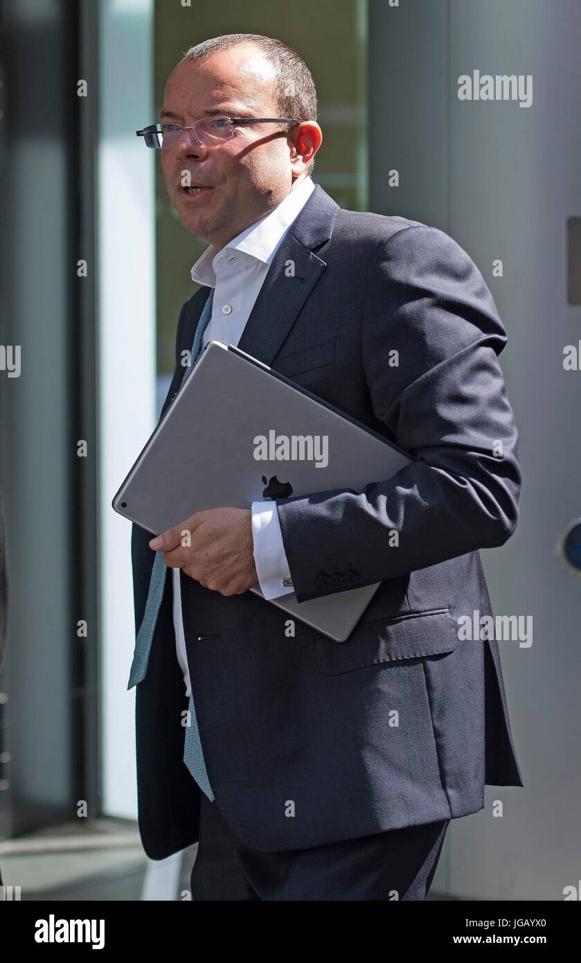 Investment banker Jeffrey Blue arrives at the High Court in London to ...