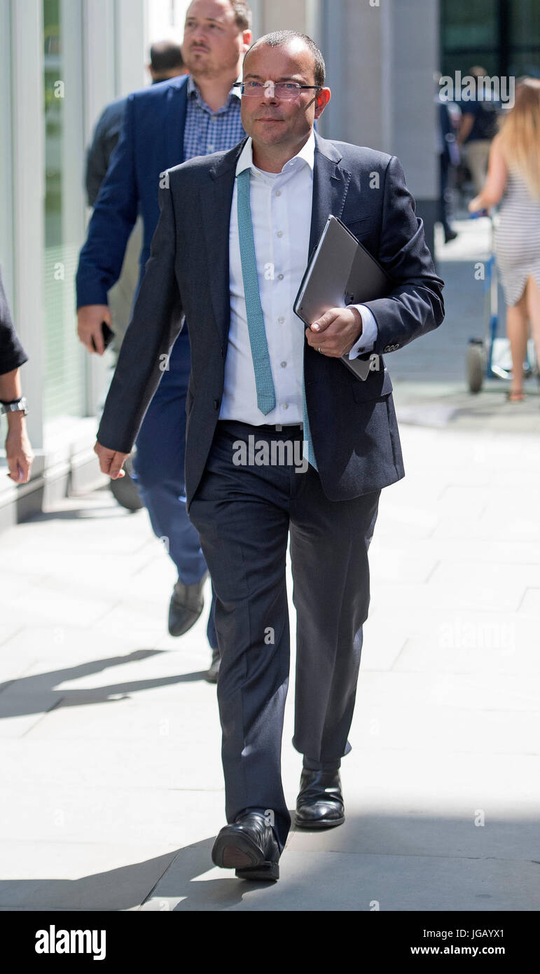 Investment banker Jeffrey Blue arrives at the High Court in London to ...