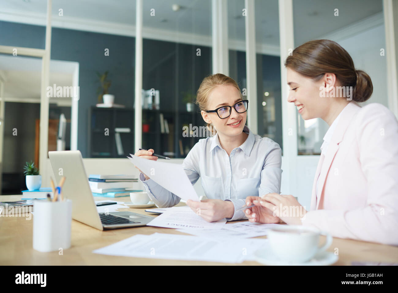 Group discussion happy paperwork hi-res stock photography and images ...