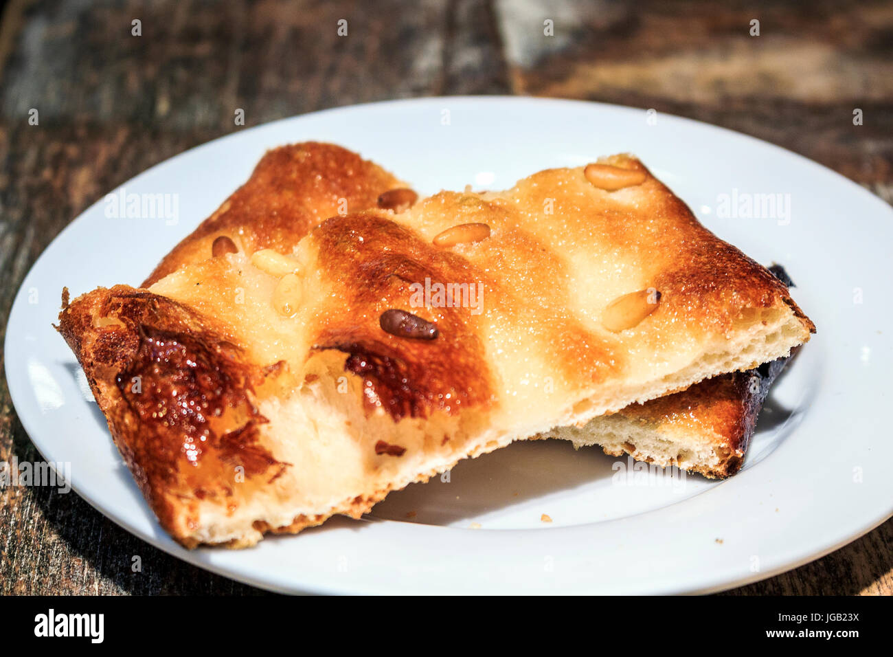 Catalan sweet and salty pastry with pine nuts Stock Photo - Alamy