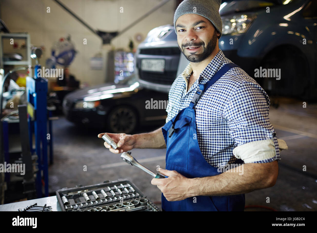 Working in garage Stock Photo - Alamy