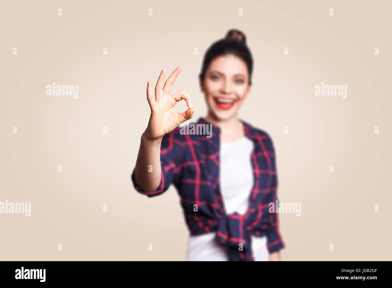 OK. Happy toothy smiley young woman showing OK sign with fingers ...
