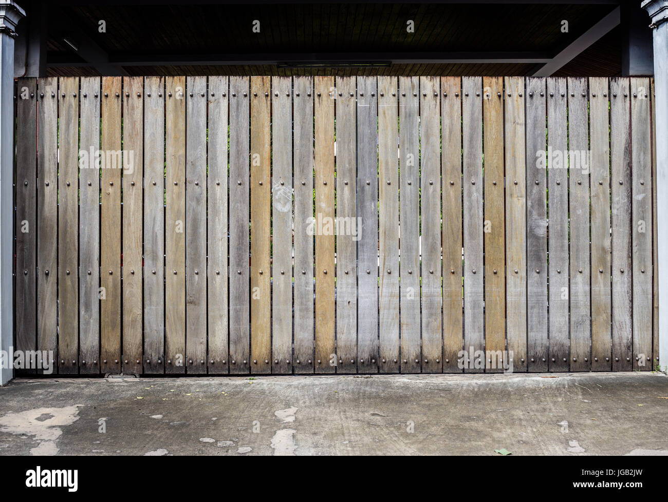 close up old wood giant gate of house for background Stock Photo - Alamy