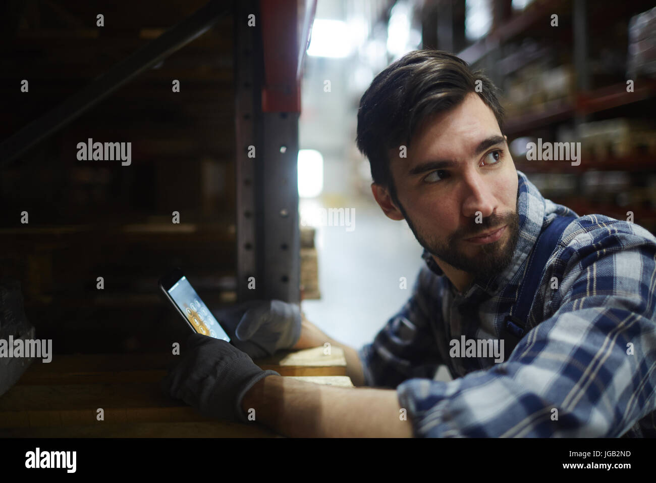 Worker with smartphone Stock Photo - Alamy