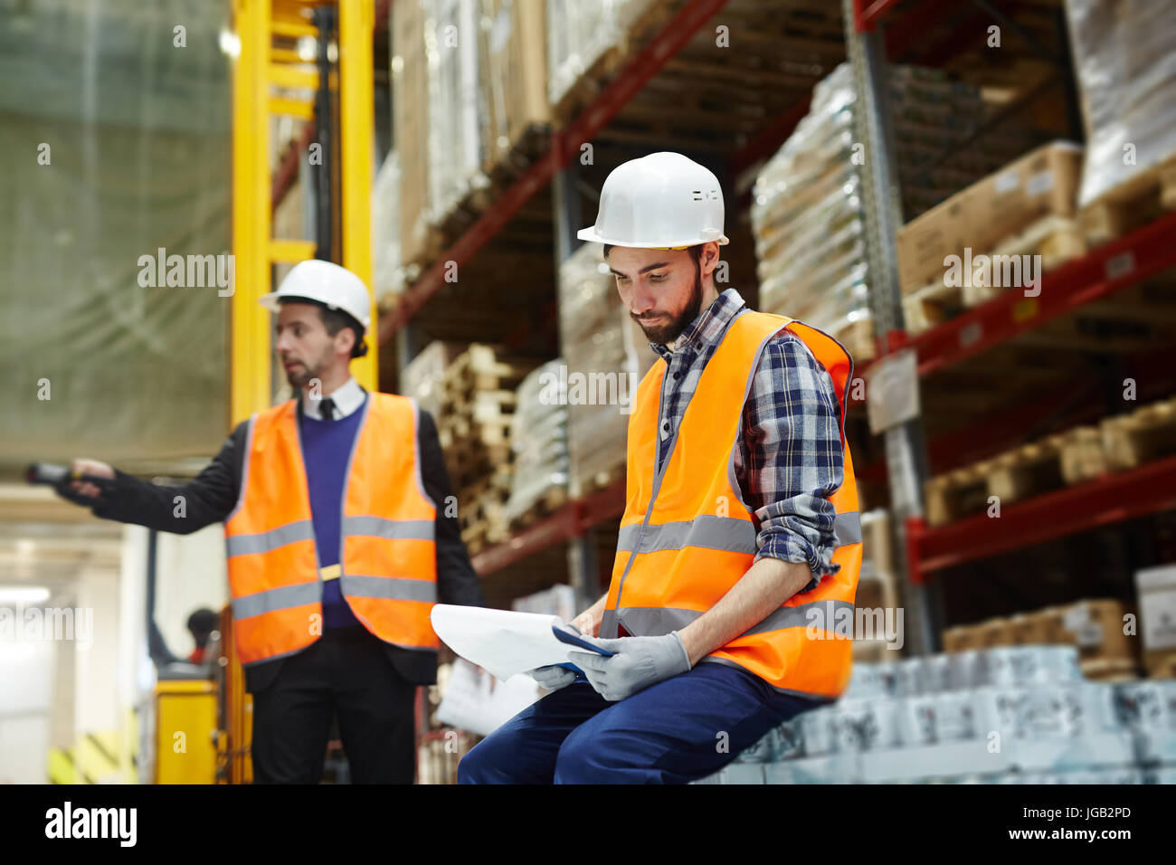 Worker with document Stock Photo - Alamy