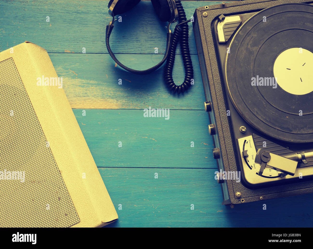 Vintage record player with headphones and speaker on old weathered ...