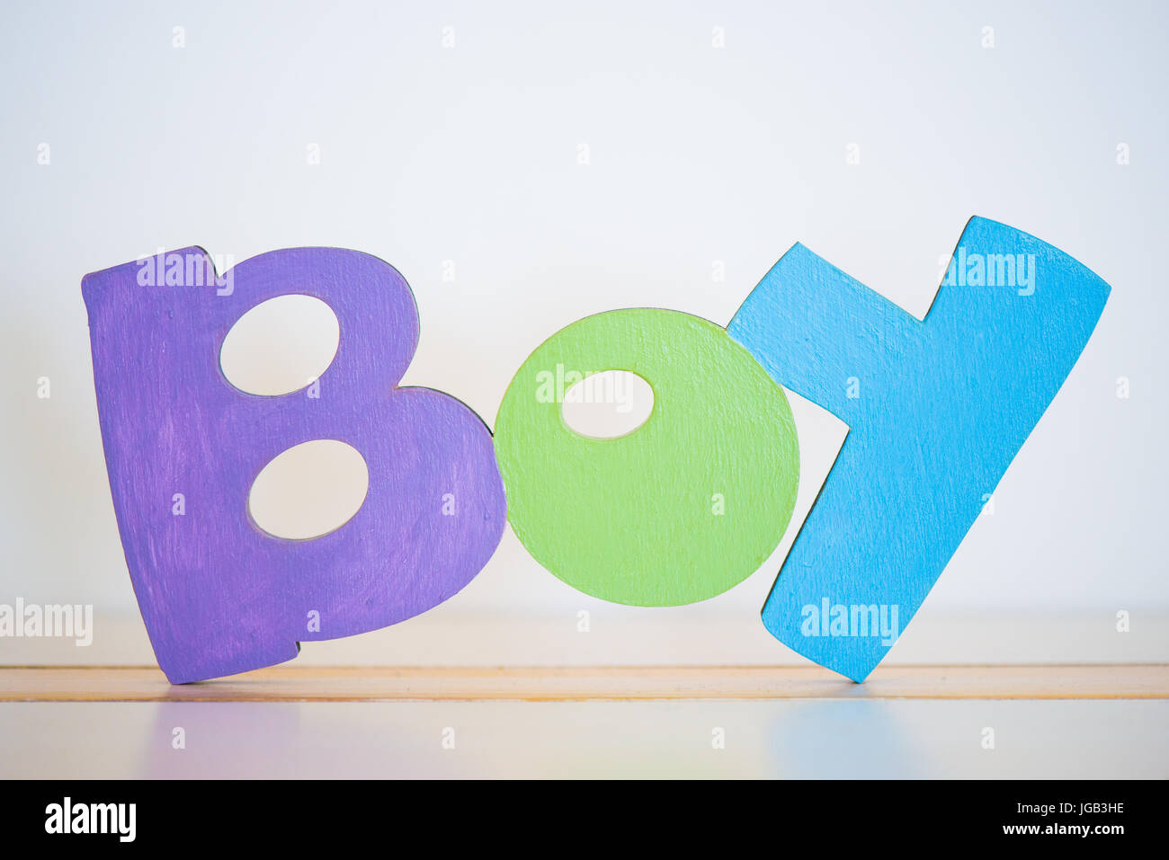 Text BOY multi-colored wooden letters of the alphabet Stock Photo - Alamy