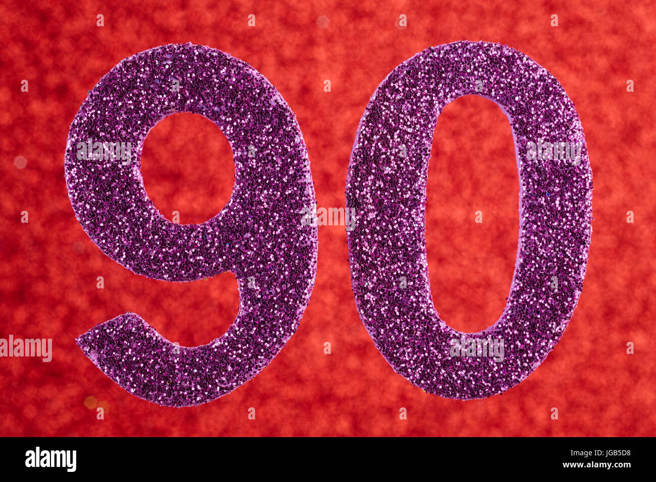 Number ninety purple color over a red background. Anniversary ...