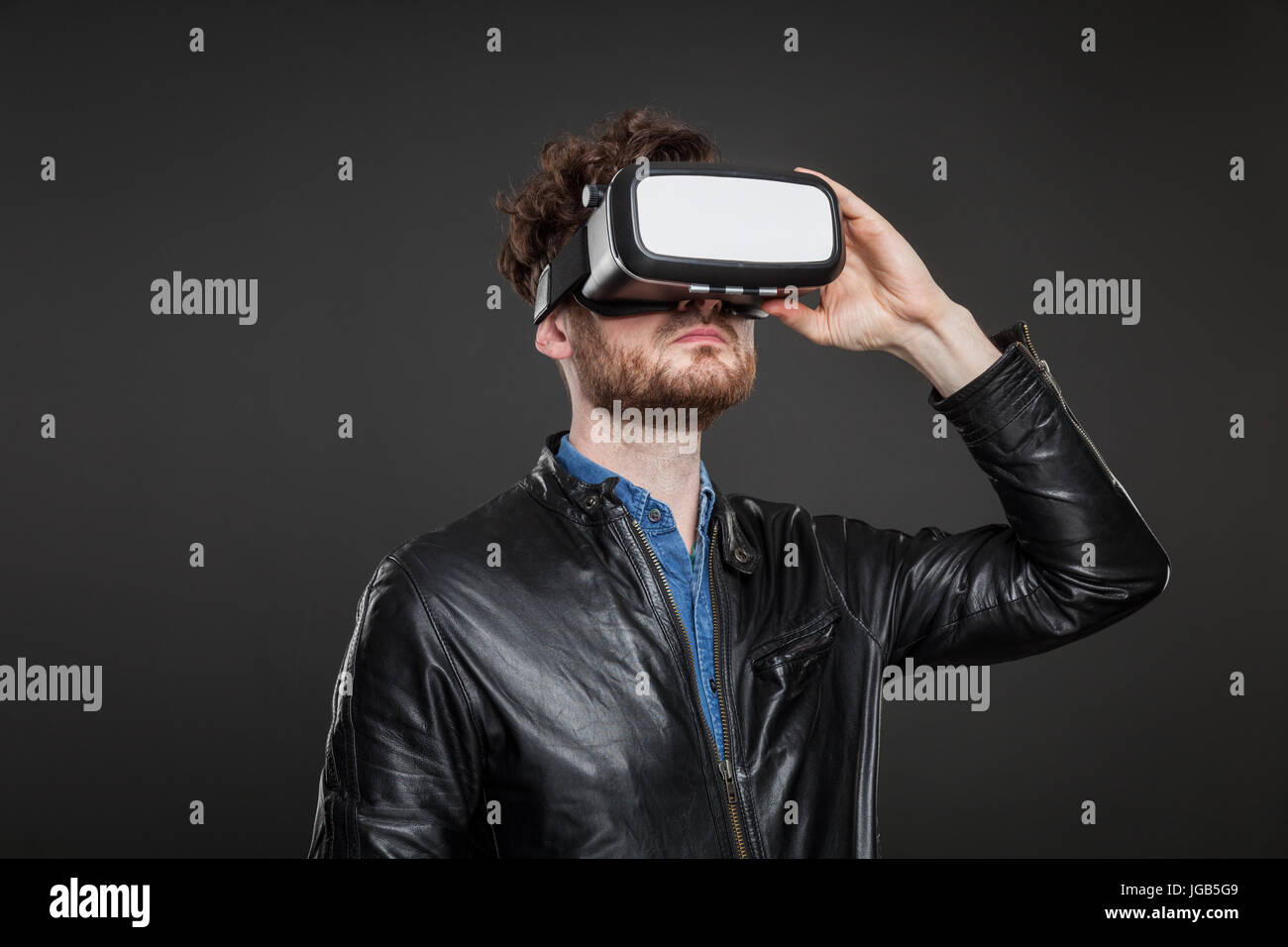 Man wearing virtual reality goggles Stock Photo - Alamy