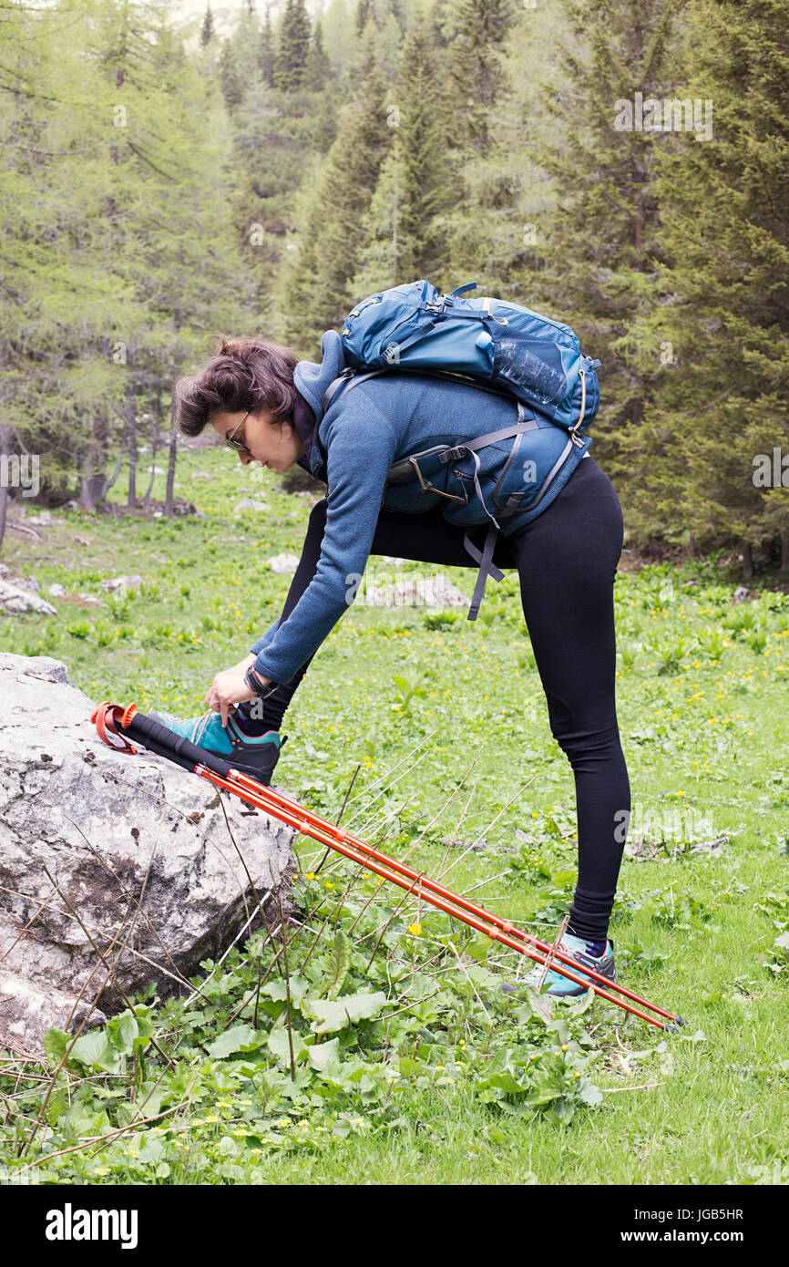View at female hiker enjoying the mountain air resting Stock Photo - Alamy