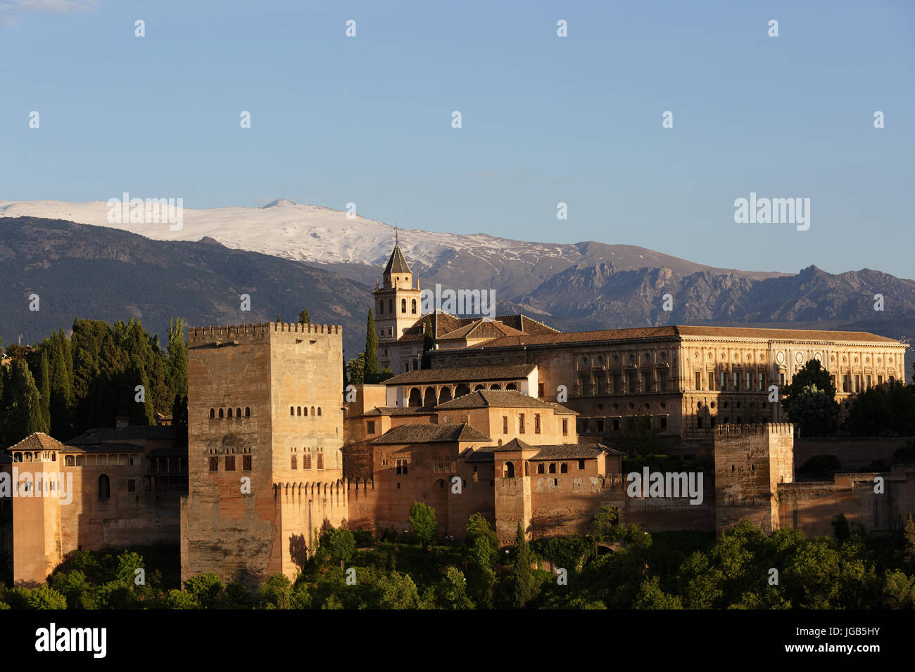 Alhambra Palace at dusk with Sierra Nevada in the background, Granada ...