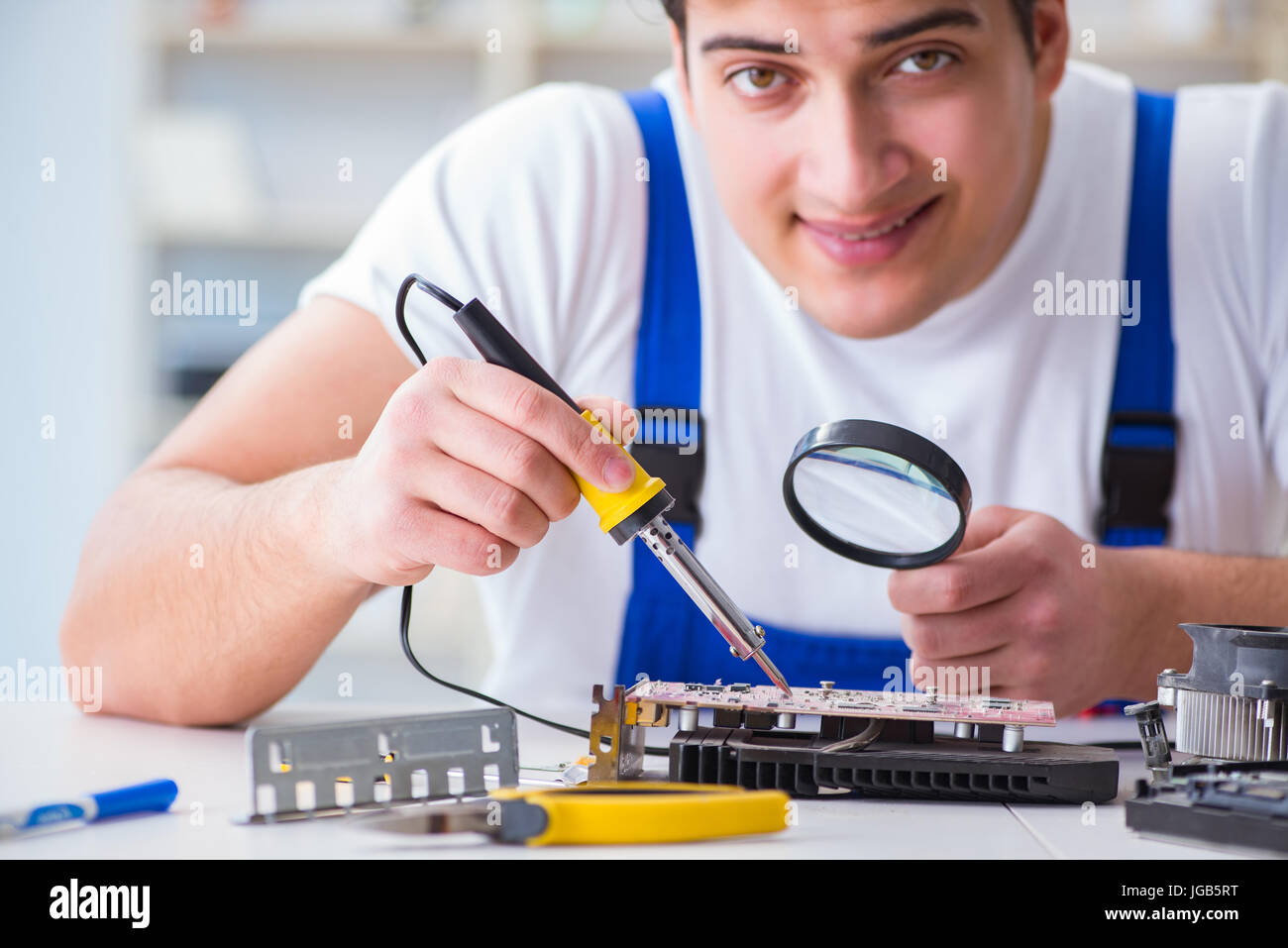 Computer repairman repairing desktop computer Stock Photo - Alamy