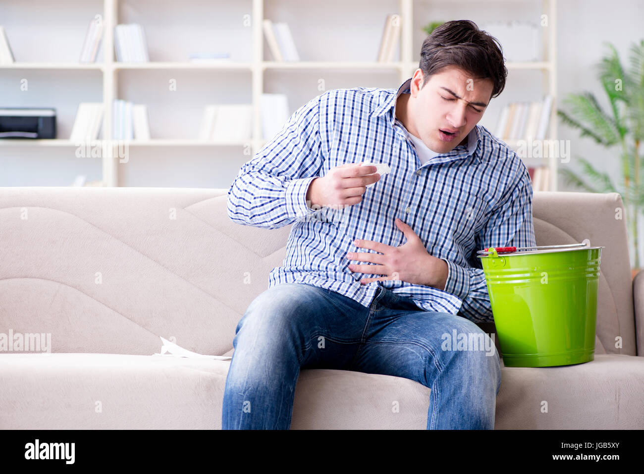 Man vomiting bucket hi-res stock photography and images - Alamy