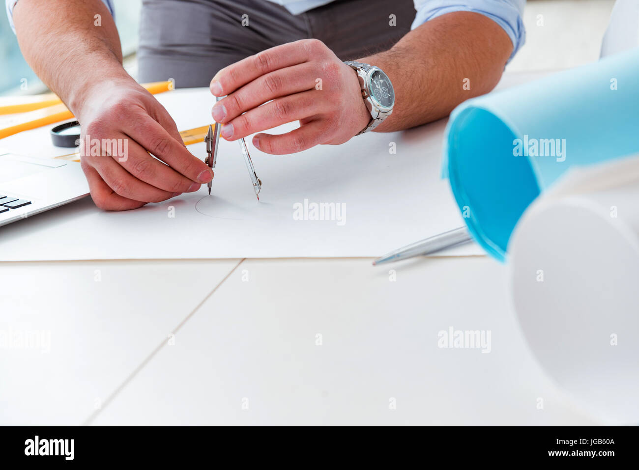 Male engineer working on drawings and blueprints Stock Photo - Alamy