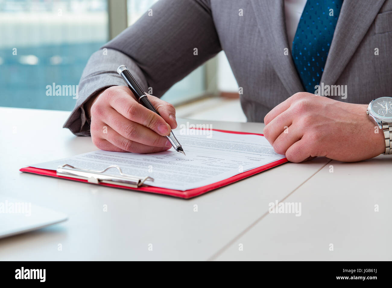 Businessman taking notes at the meeting Stock Photo - Alamy