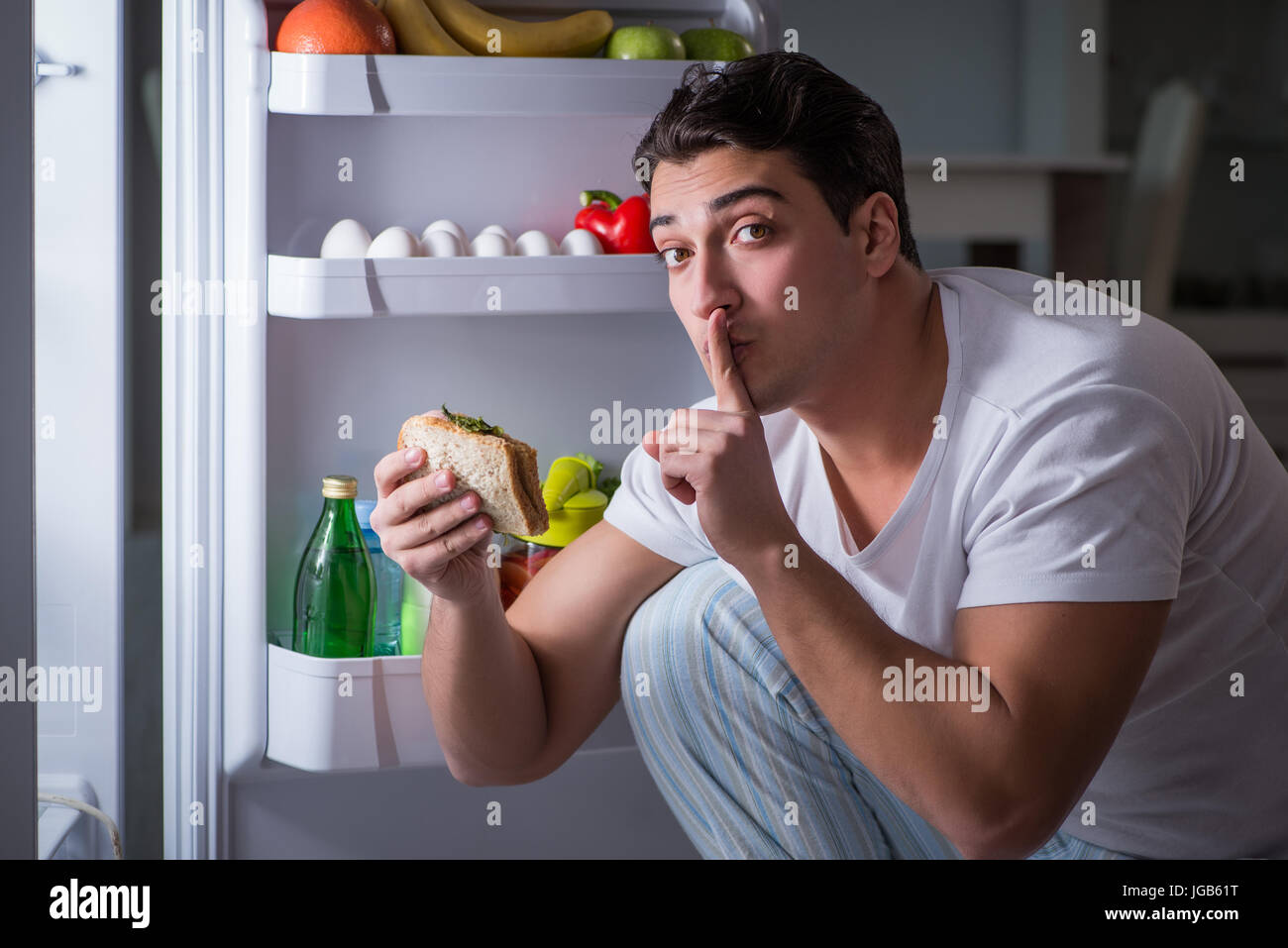 Man eating night sandwich hi-res stock photography and images - Alamy