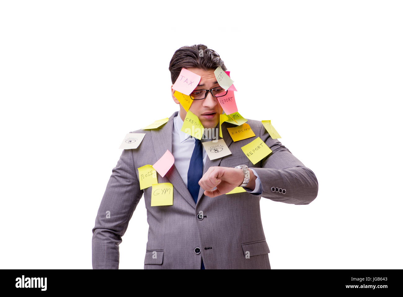 Businessman with many reminders isolated on white Stock Photo - Alamy