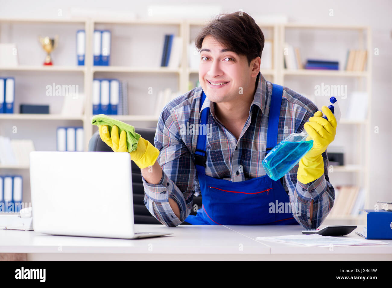 Male cleaner working in the office Stock Photo - Alamy