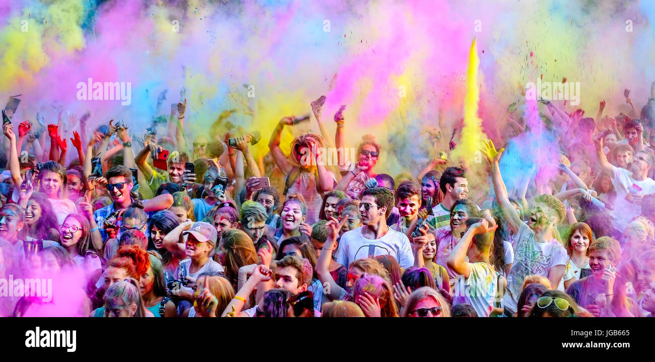 Happy young people dancing and celebrating during Music and Colors ...