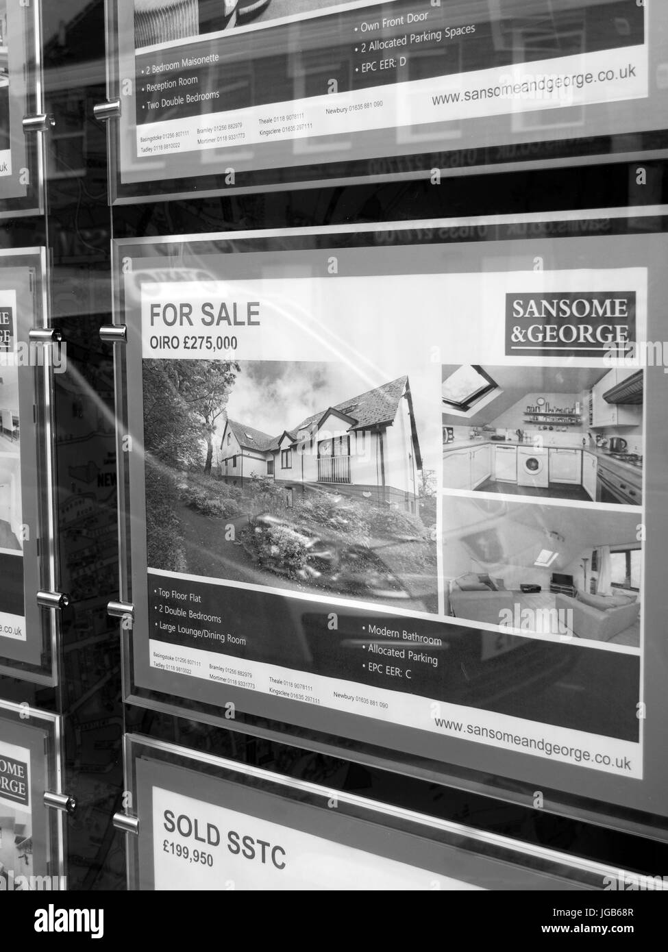Estate agent window display Black and White Stock Photos & Images - Alamy
