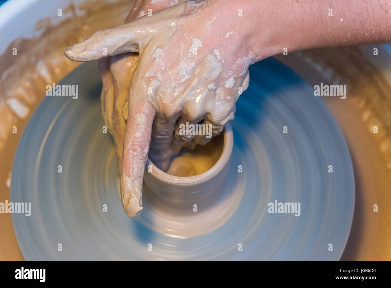 Pottering - creating a clay cup in process. Shot with a small GRIP ...